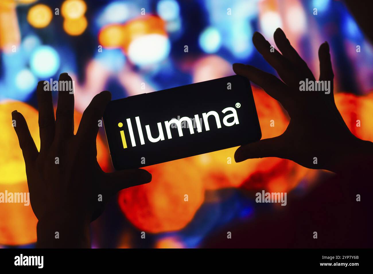 In this photo illustration, the Illumina logo is displayed on a ...
