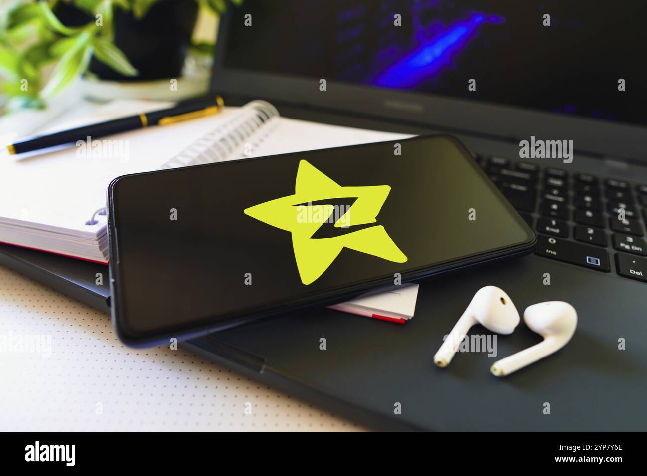 In this photo illustration, the QZone logo is displayed on a smartphone ...