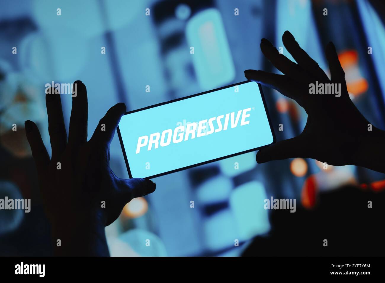 In this photo illustration, the Progressive Corporation logo is ...