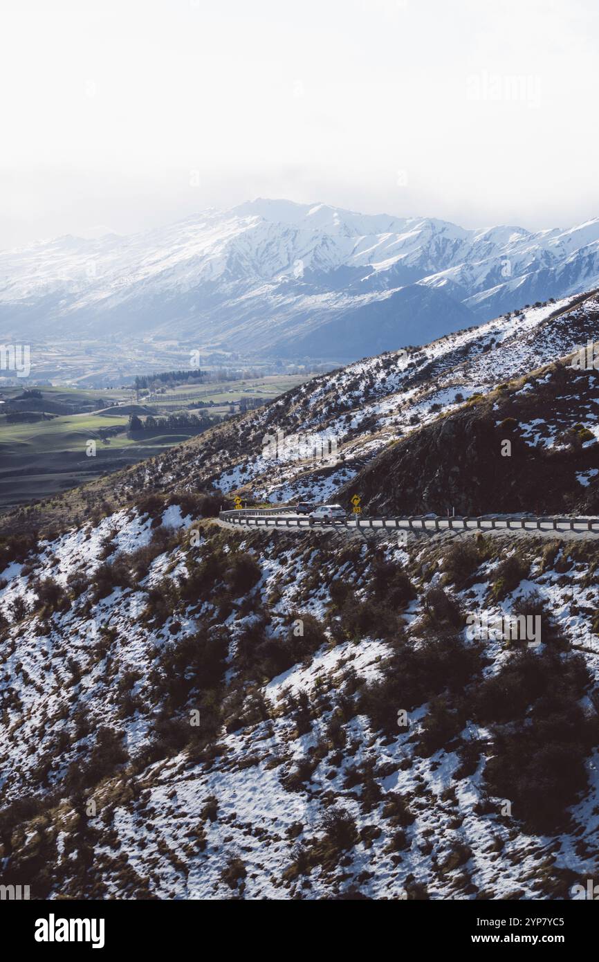 Snowy mountain slopes with winding road in cool weather, Queenstown ...
