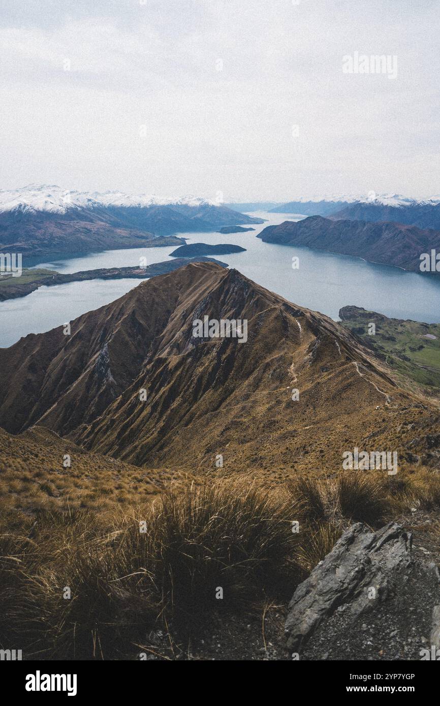 Mountain top with view of a large lake and surrounding mountain ranges ...