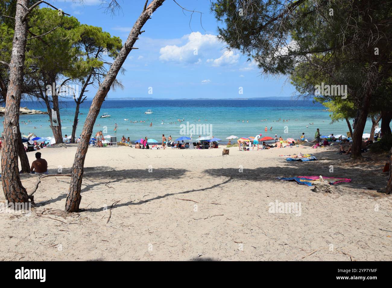 Beautiful scenery. View of the blue sea, sky and a crowded sandy beach ...