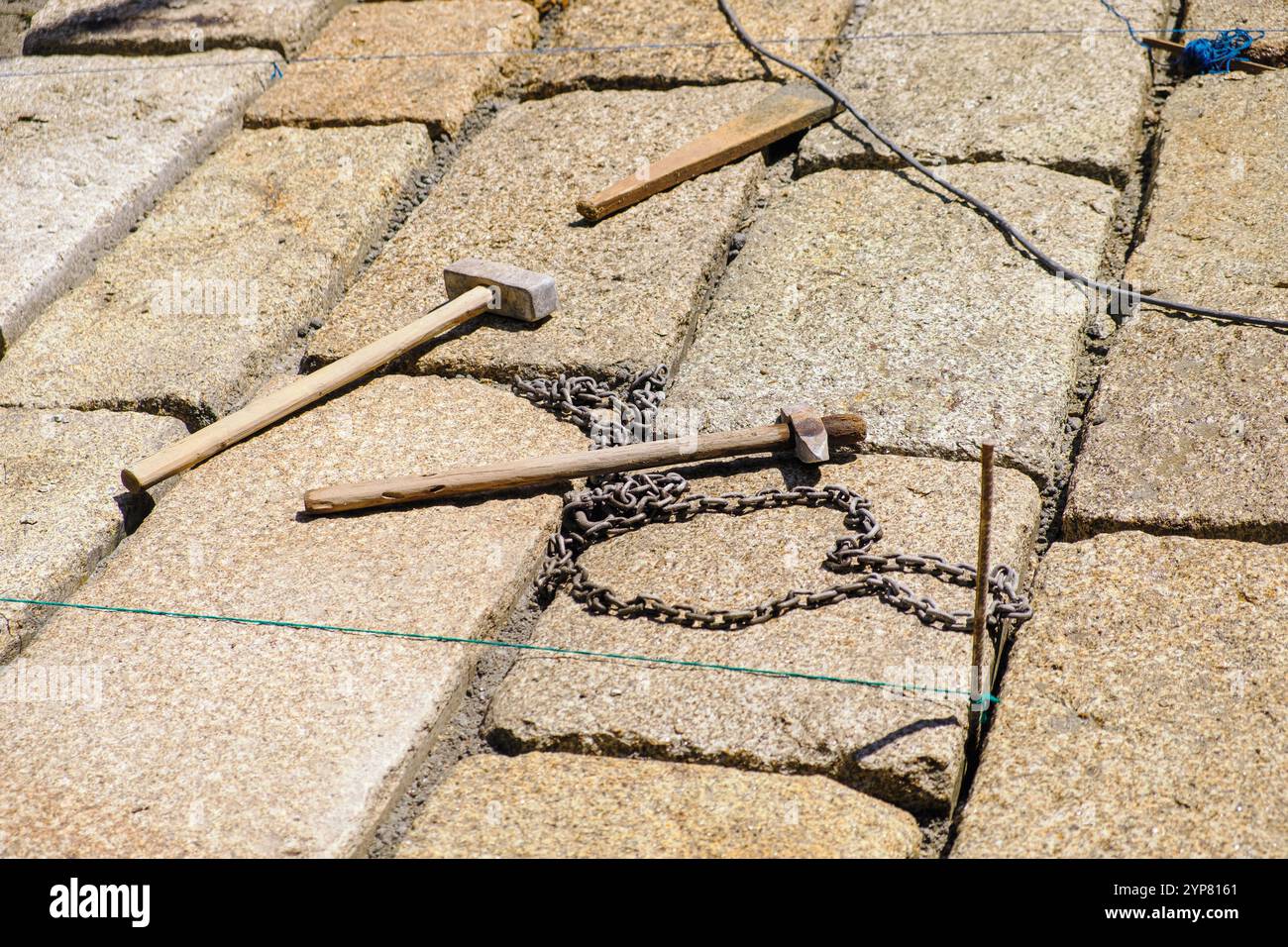 tools for stone masonry work with granite ashlars Stock Photo - Alamy