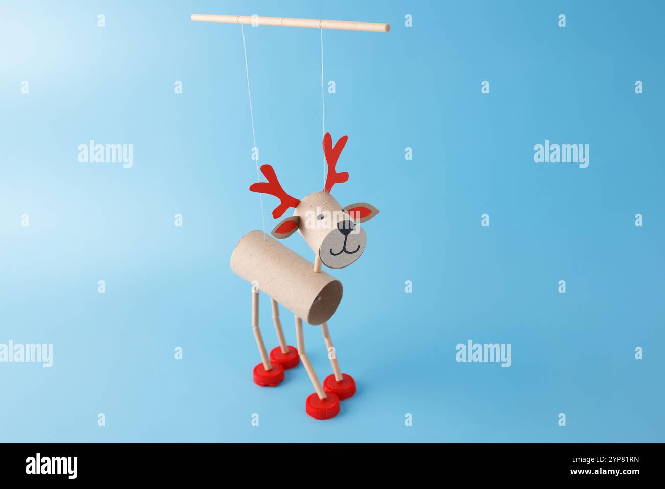 DIY reindeer puppet made from cardboard tubes, red bottle caps, and ...