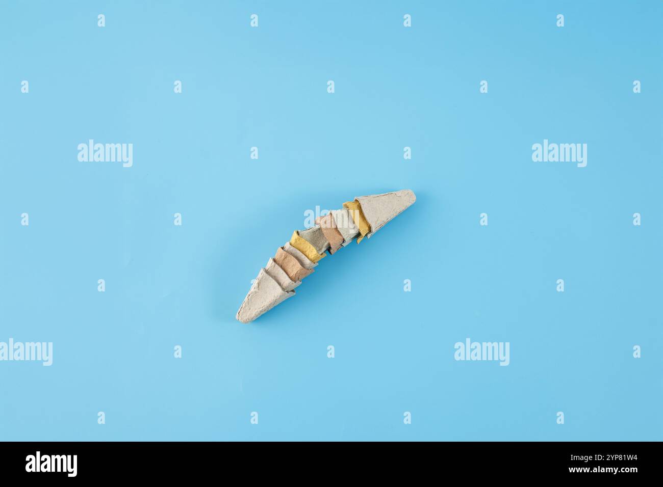 a series of cone-shaped objects from a rough, fibrous material, likely ...