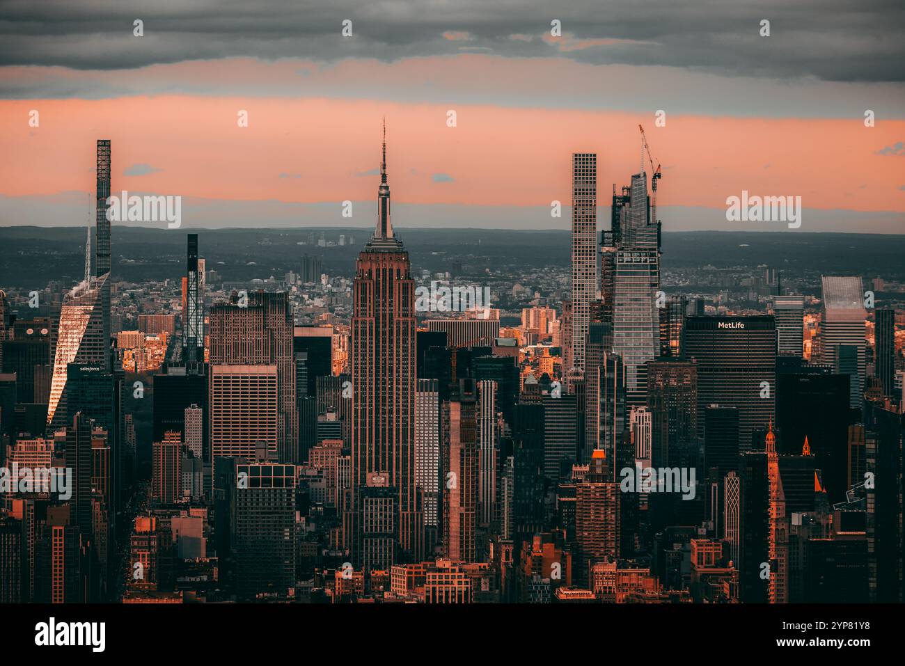 A captivating sunset view of the Manhattan skyline featuring the Empire ...