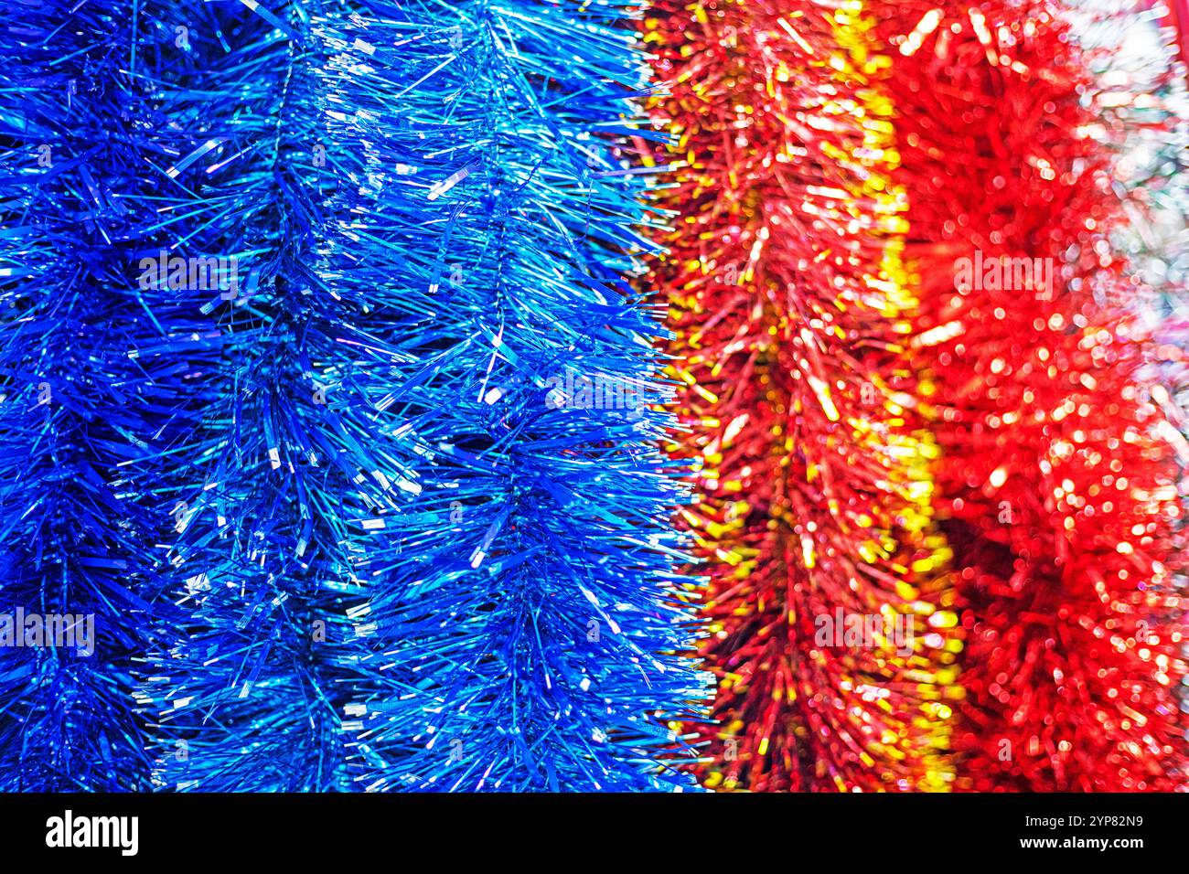 New Year's shiny background of multi-colored paper garlands for ...
