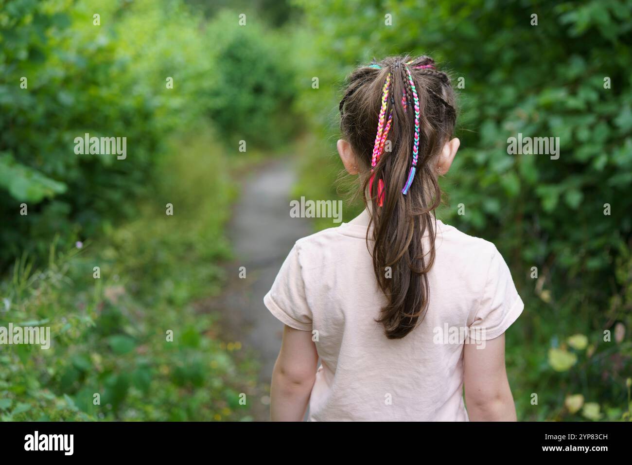 Little sad girl with dreadlocks and missing front tooth walks in the ...