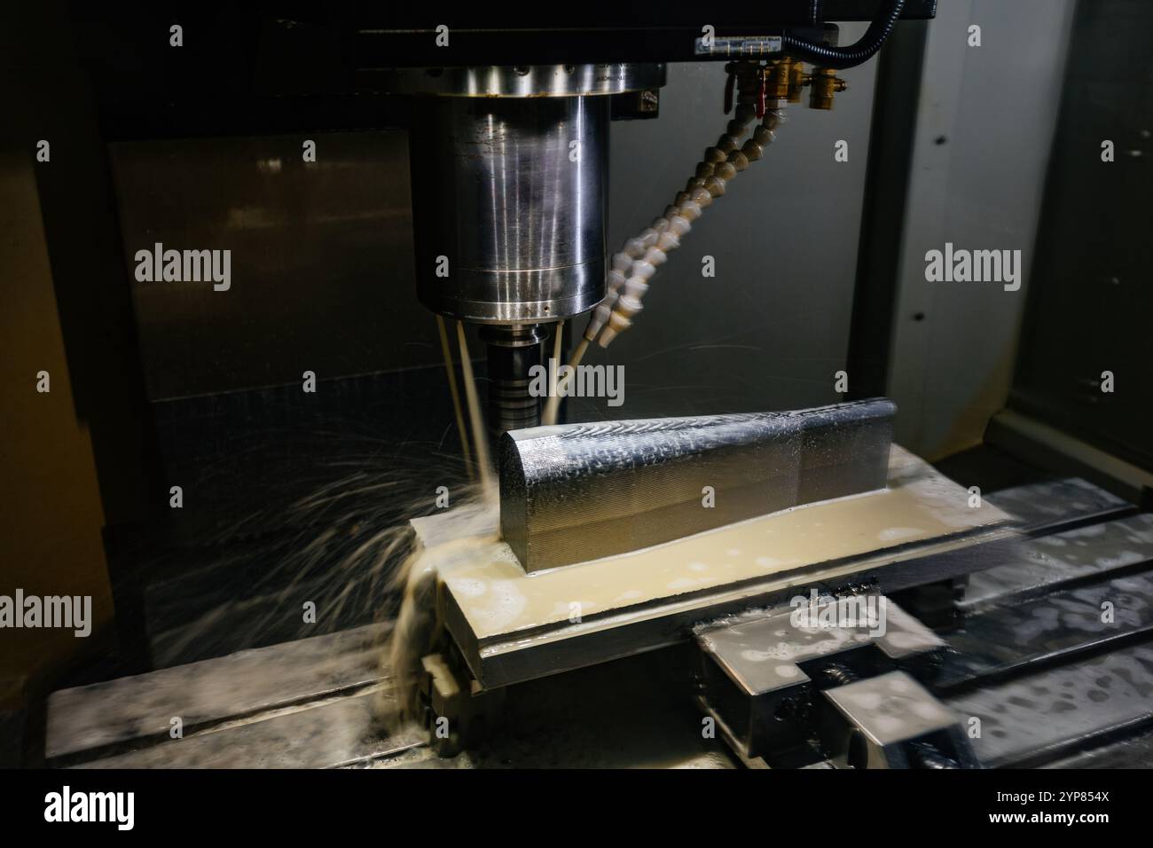 Milling machine with liquid coolant, close up Stock Photo - Alamy