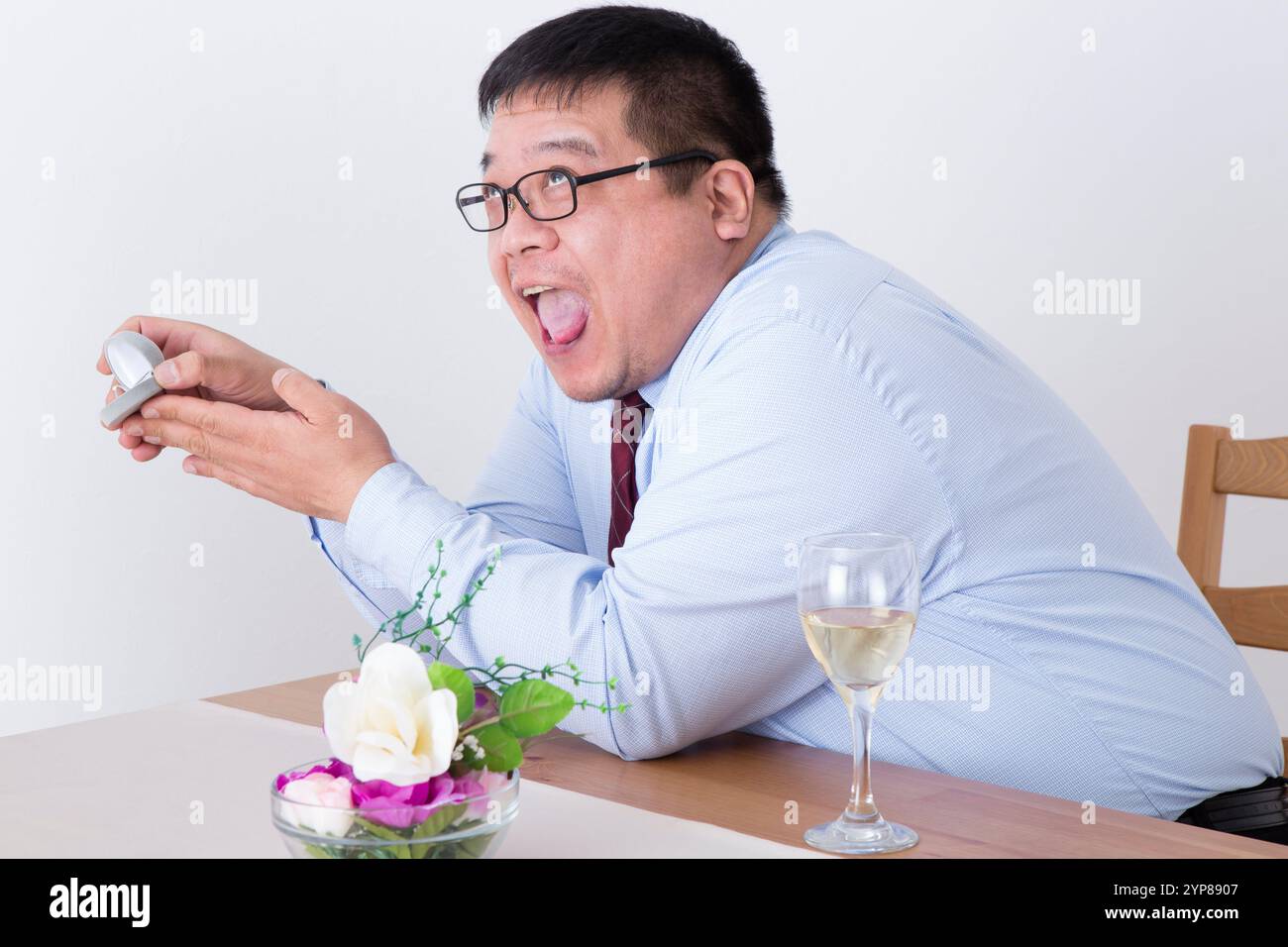 Man handing over rings Stock Photo - Alamy
