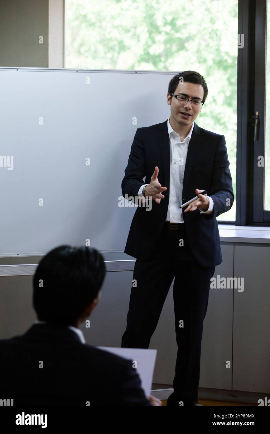 Business people making presentations Stock Photo - Alamy