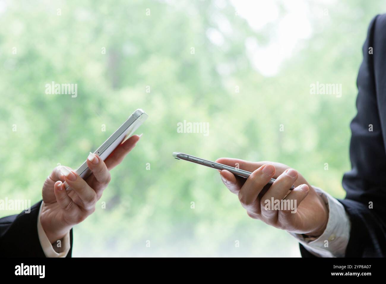 Business people exchanging contact details Stock Photo - Alamy