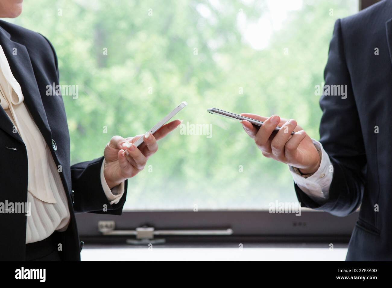 Business people exchanging contact details Stock Photo - Alamy