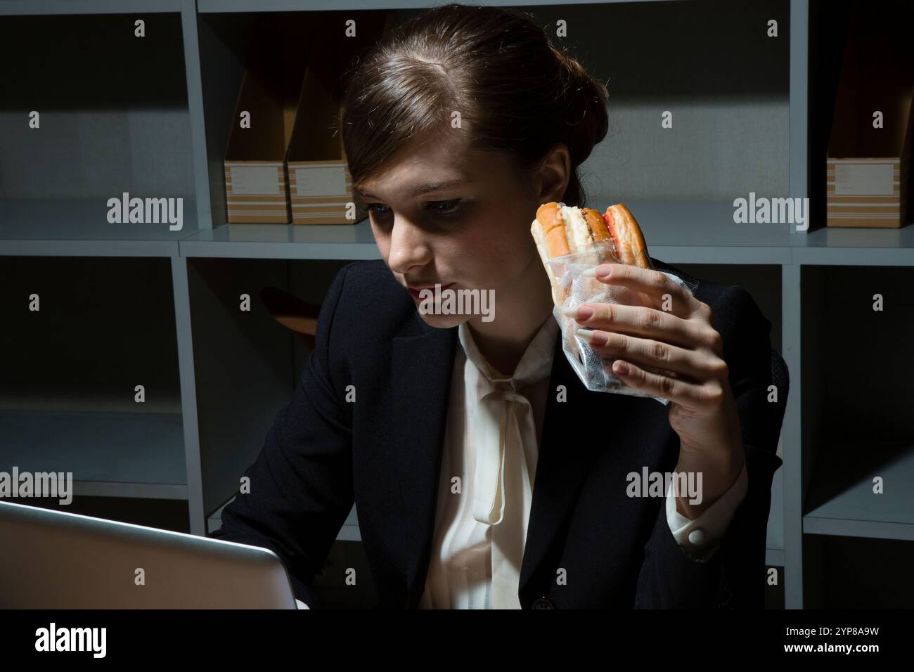 Businesswoman eating workplace hi-res stock photography and images - Alamy