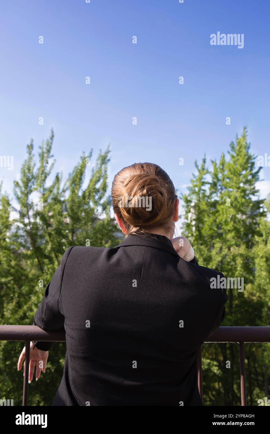 Business people looking out from rooftop Stock Photo - Alamy