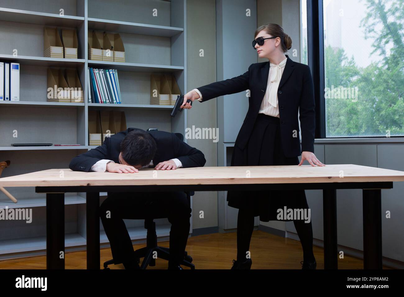 Female assassin in suit Stock Photo - Alamy