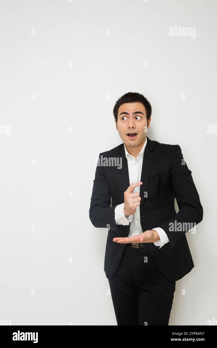 Businessman in an inspirational pose Stock Photo - Alamy