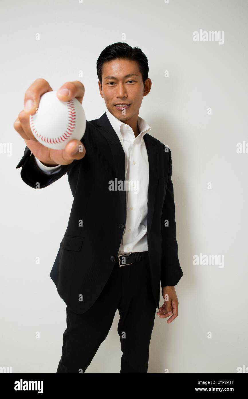 Businessman with baseball ball Stock Photo - Alamy