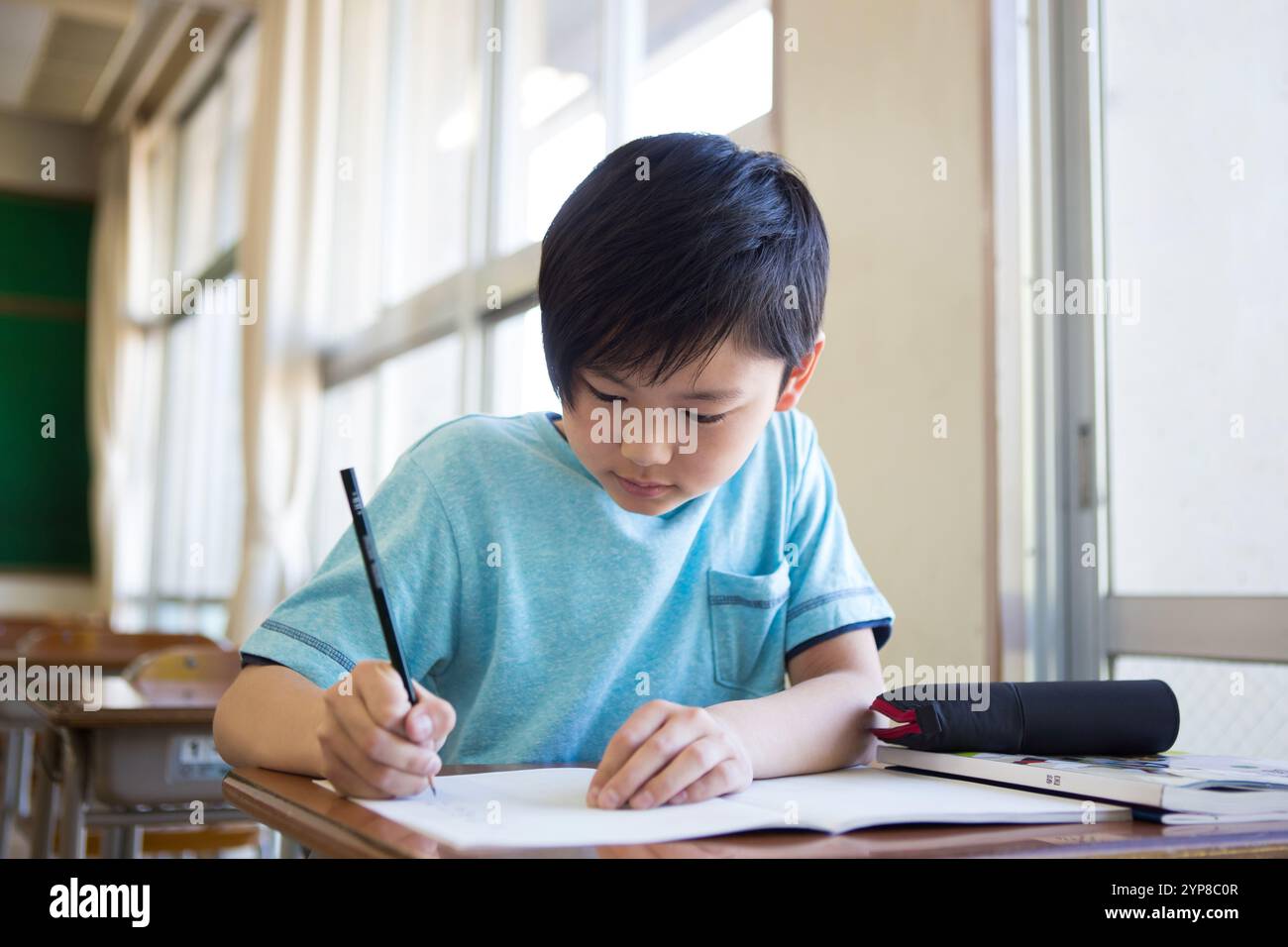 Boys studying in the classroom Stock Photo - Alamy