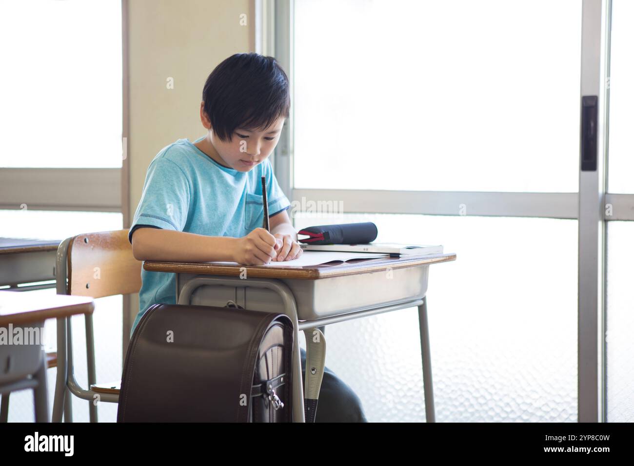 Boys studying in the classroom Stock Photo - Alamy