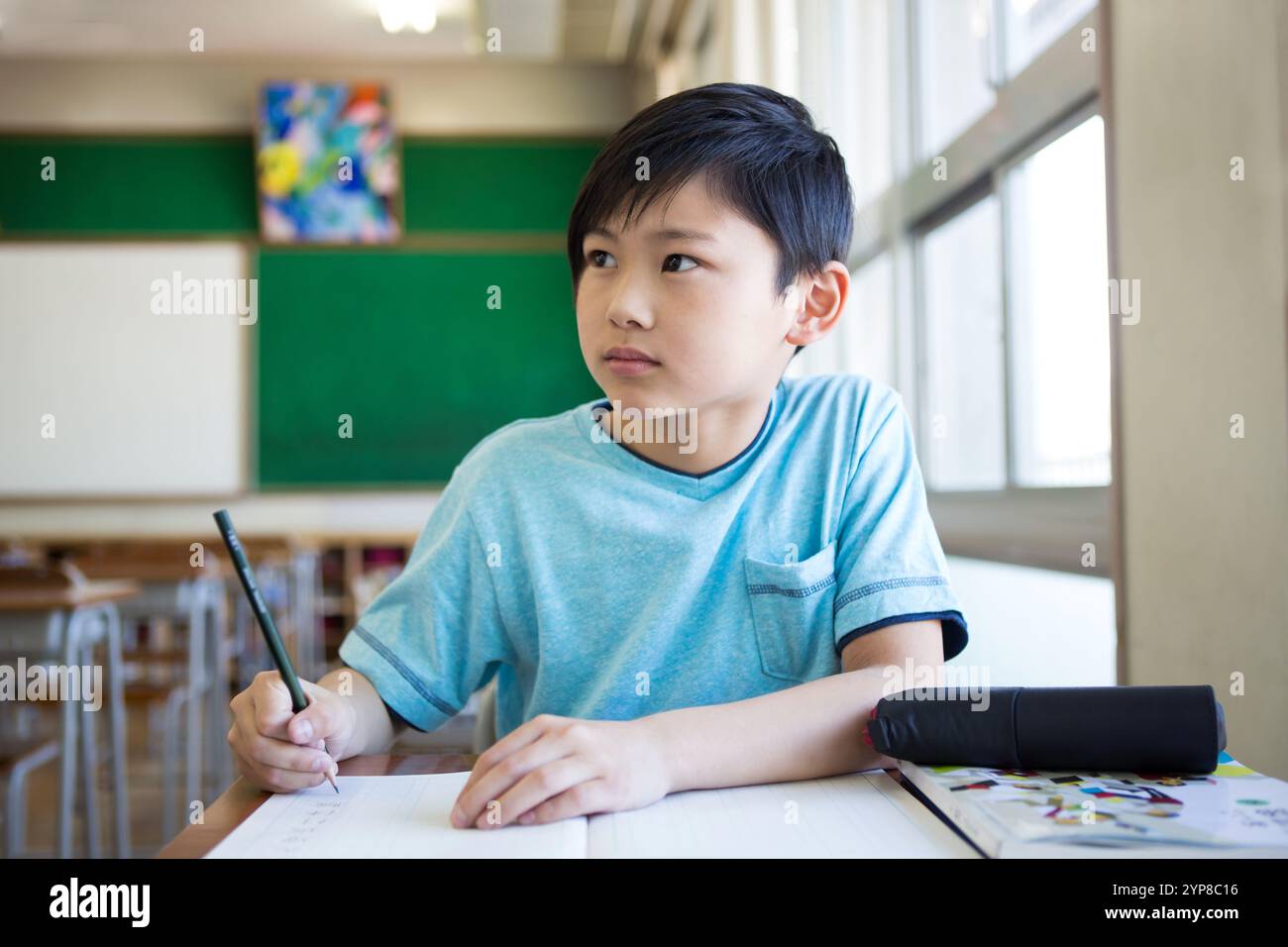 Boys studying in the classroom Stock Photo - Alamy