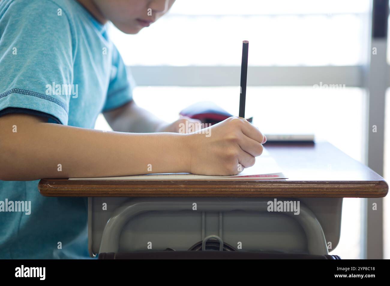 Boys studying in the classroom Stock Photo - Alamy