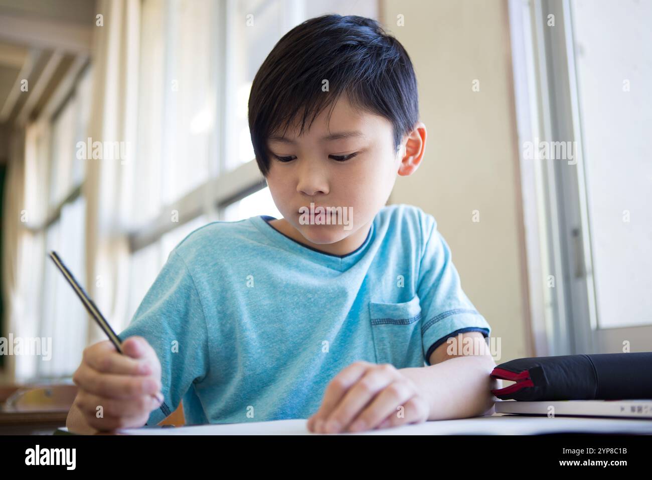 Boys studying in the classroom Stock Photo - Alamy