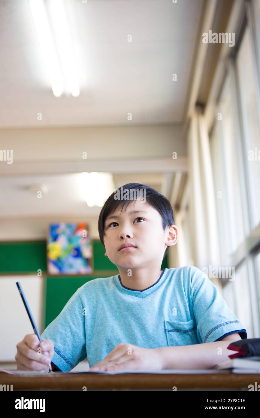 Boys studying in the classroom Stock Photo - Alamy