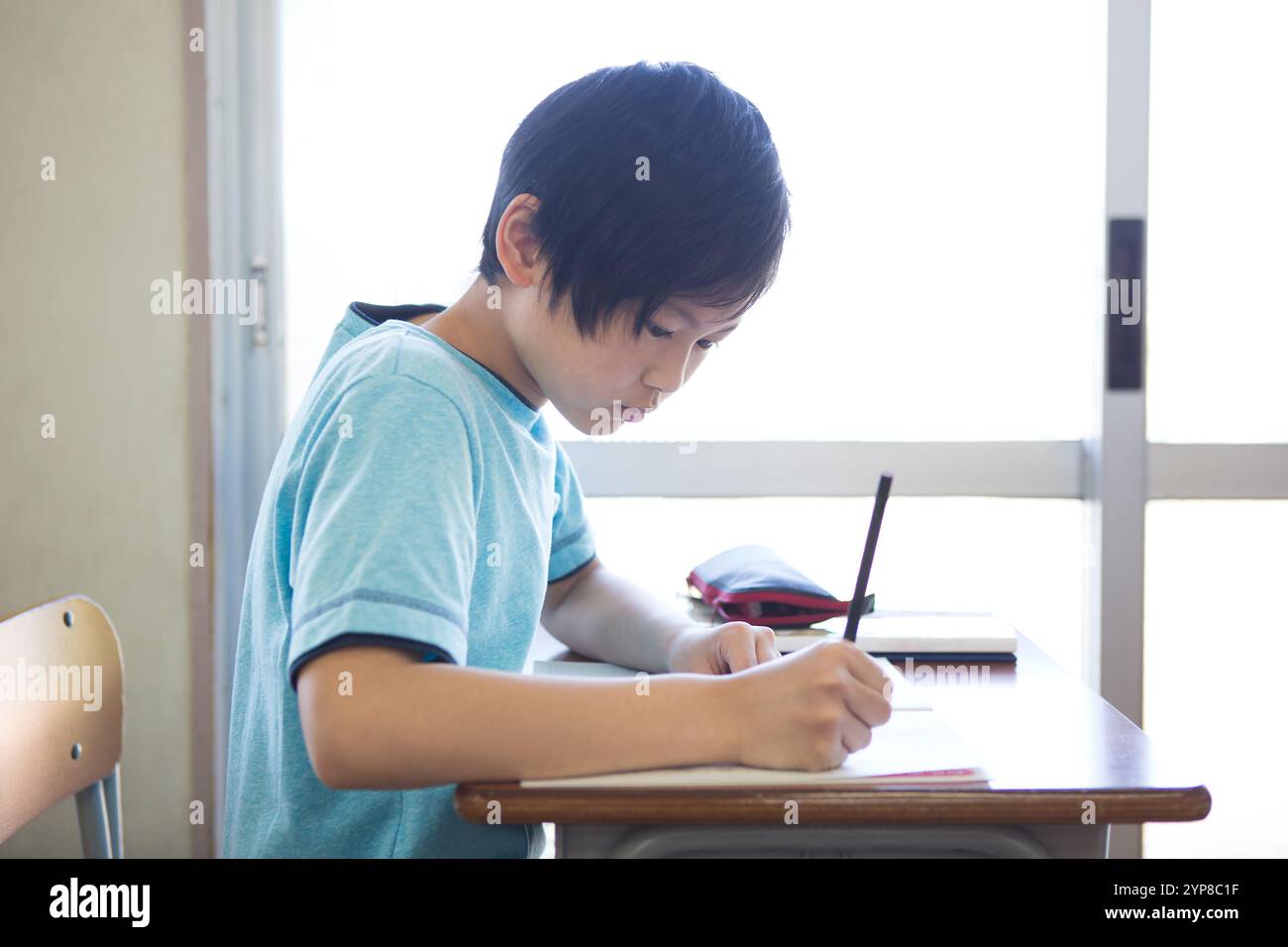 Boys studying in the classroom Stock Photo - Alamy