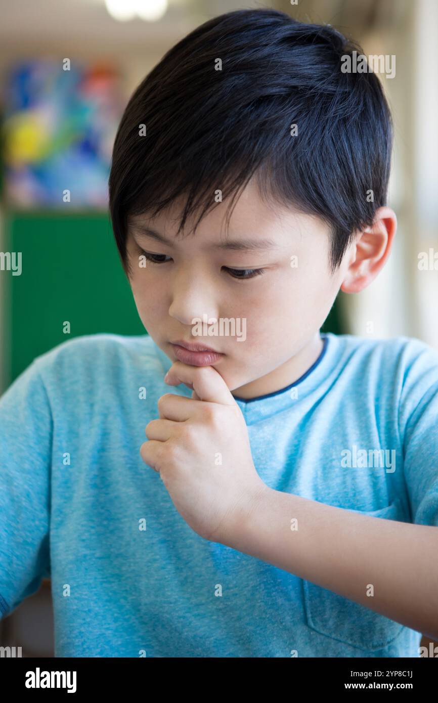 Boys studying in the classroom Stock Photo - Alamy