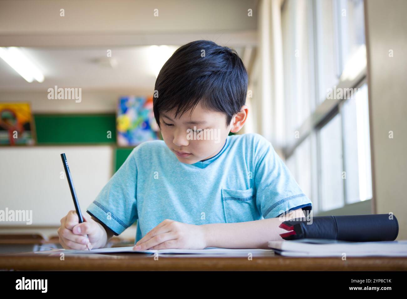 Boys studying in the classroom Stock Photo - Alamy