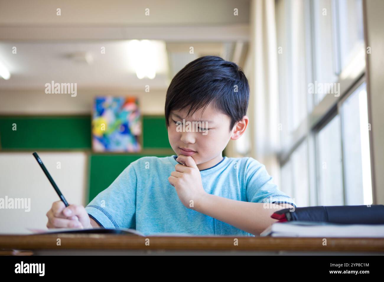 Boys studying in the classroom Stock Photo - Alamy