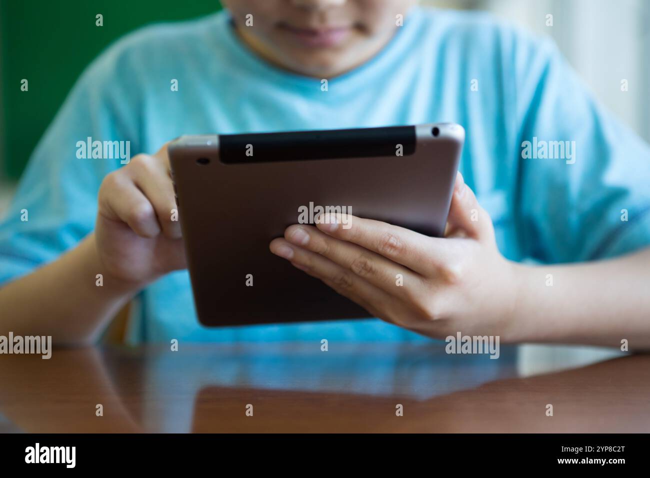Boy using tablet Stock Photo - Alamy