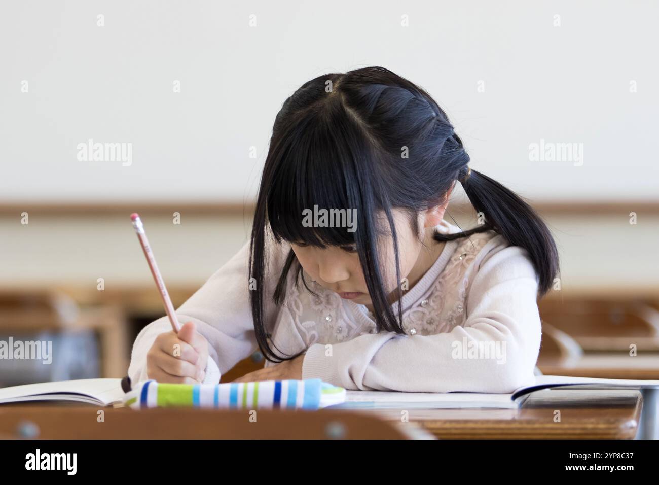 Girls studying in a classroom Stock Photo - Alamy