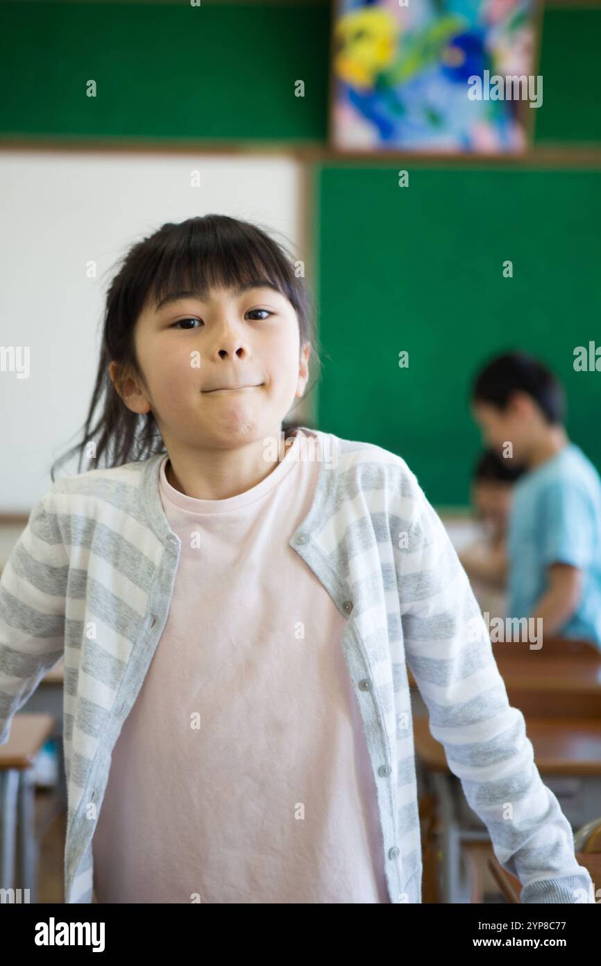 Primary school pupil in classroom Stock Photo - Alamy