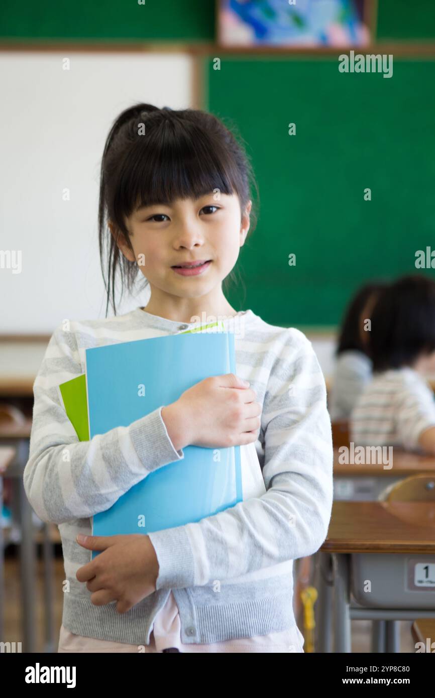 Primary school pupil in classroom Stock Photo - Alamy