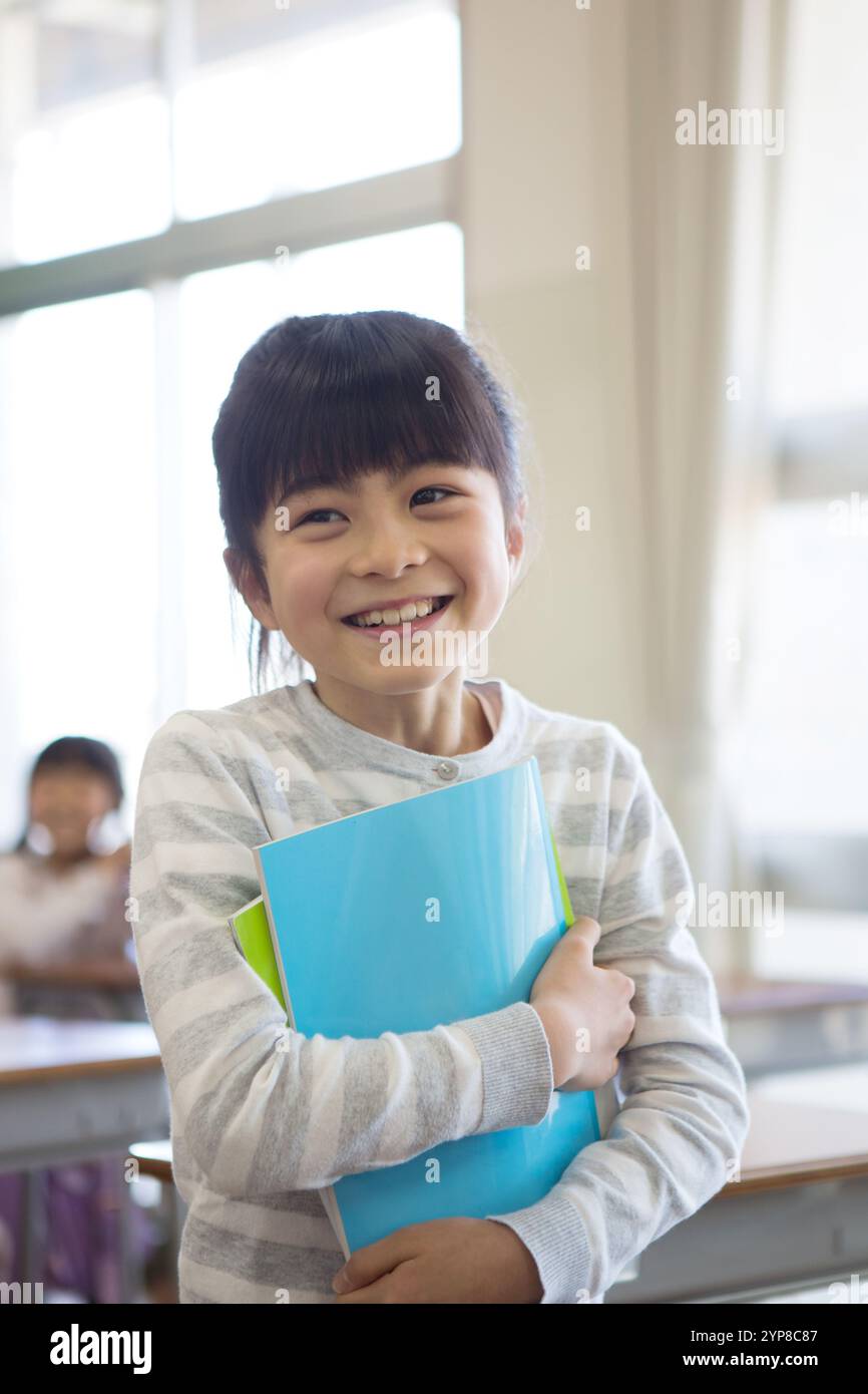 Primary school pupil in classroom Stock Photo - Alamy
