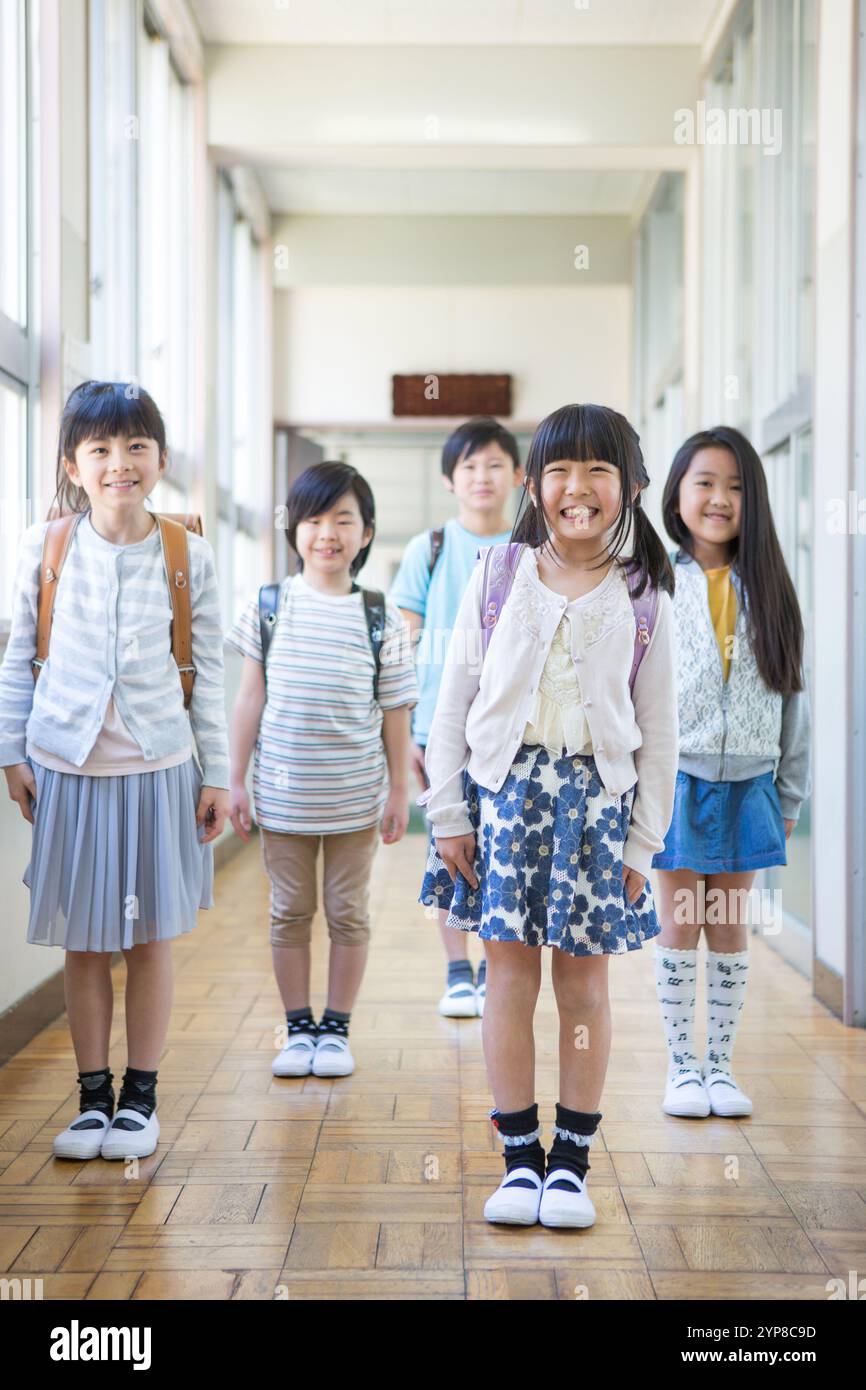 Primary school children carrying school backpacks Stock Photo - Alamy
