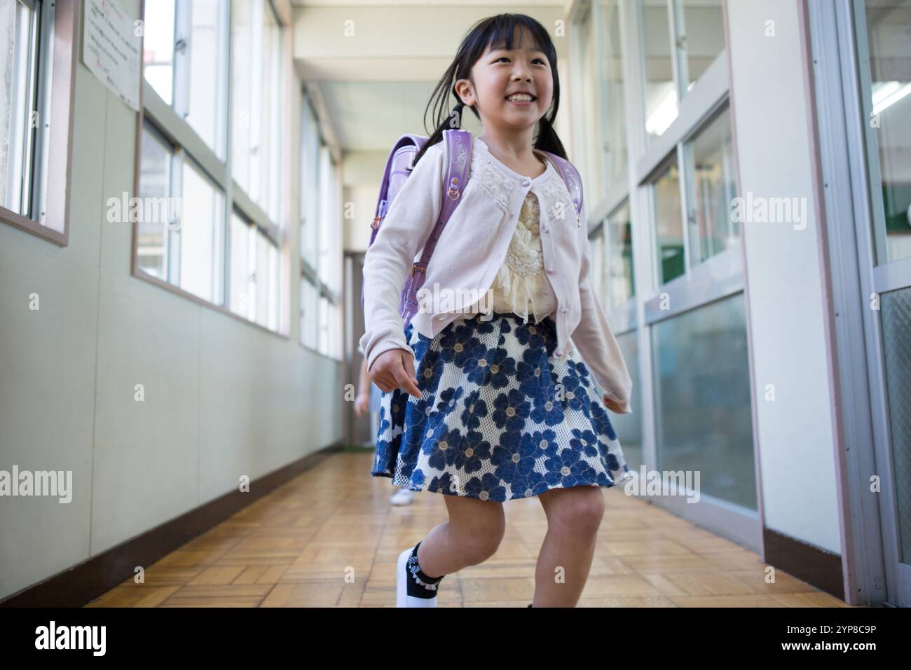 Primary school children carrying school backpacks Stock Photo - Alamy