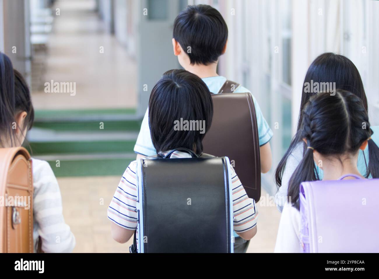 Primary school children carrying school backpacks Stock Photo - Alamy
