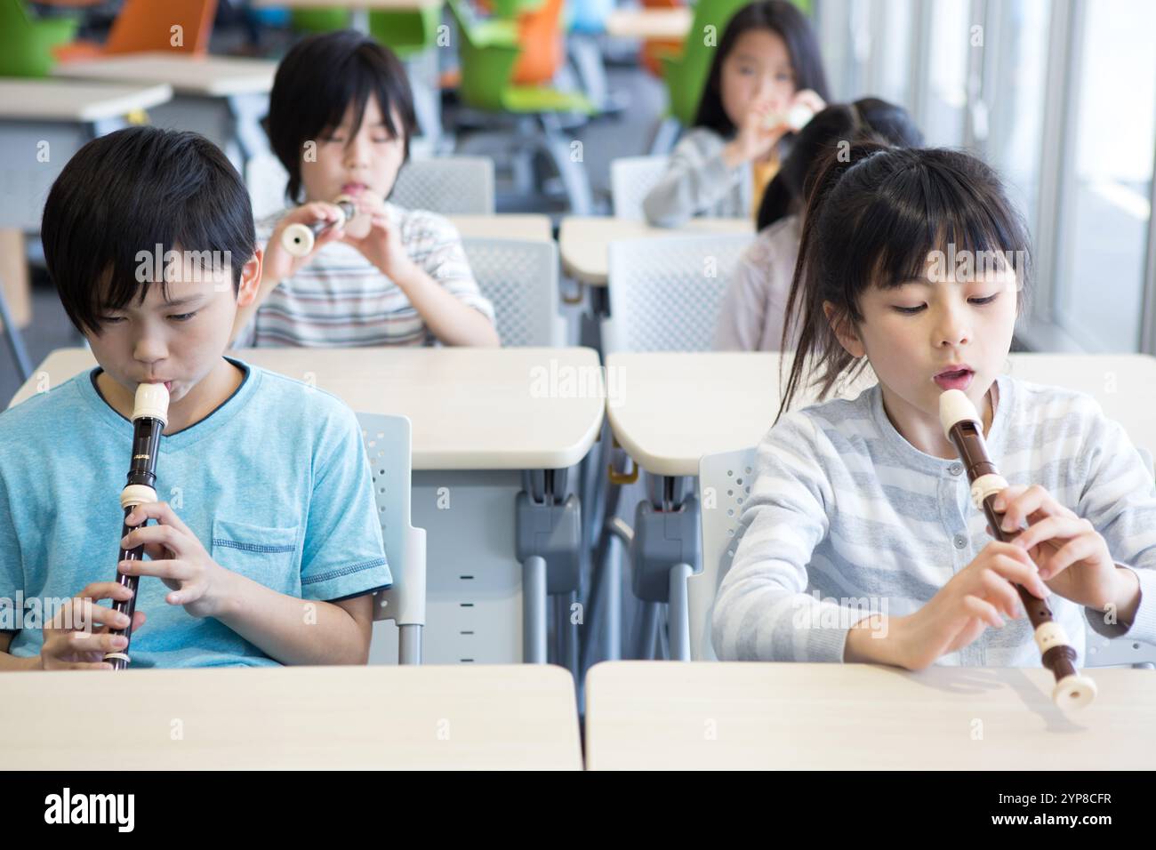 Primary school children taking music lessons Stock Photo - Alamy