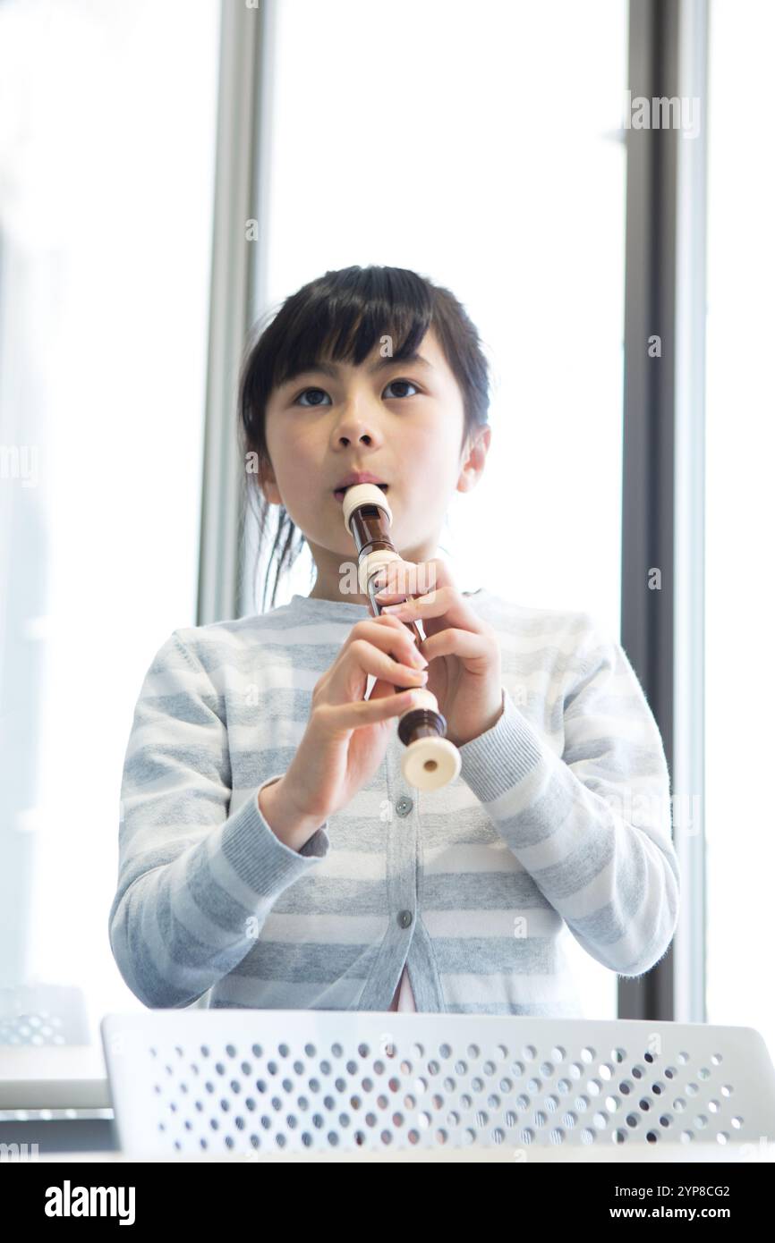 Primary school children taking music lessons Stock Photo - Alamy