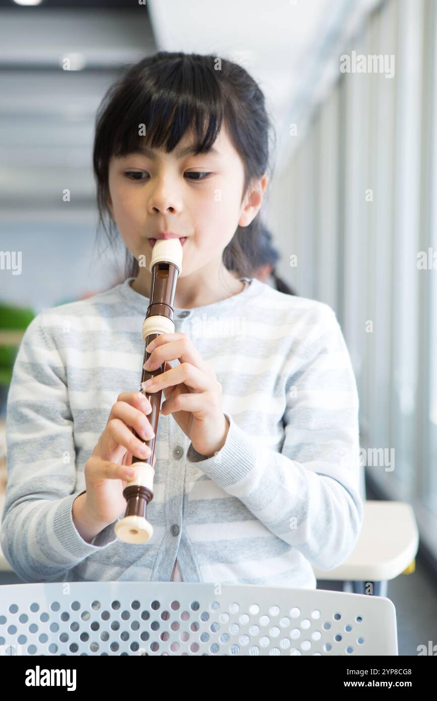 Primary school children taking music lessons Stock Photo - Alamy