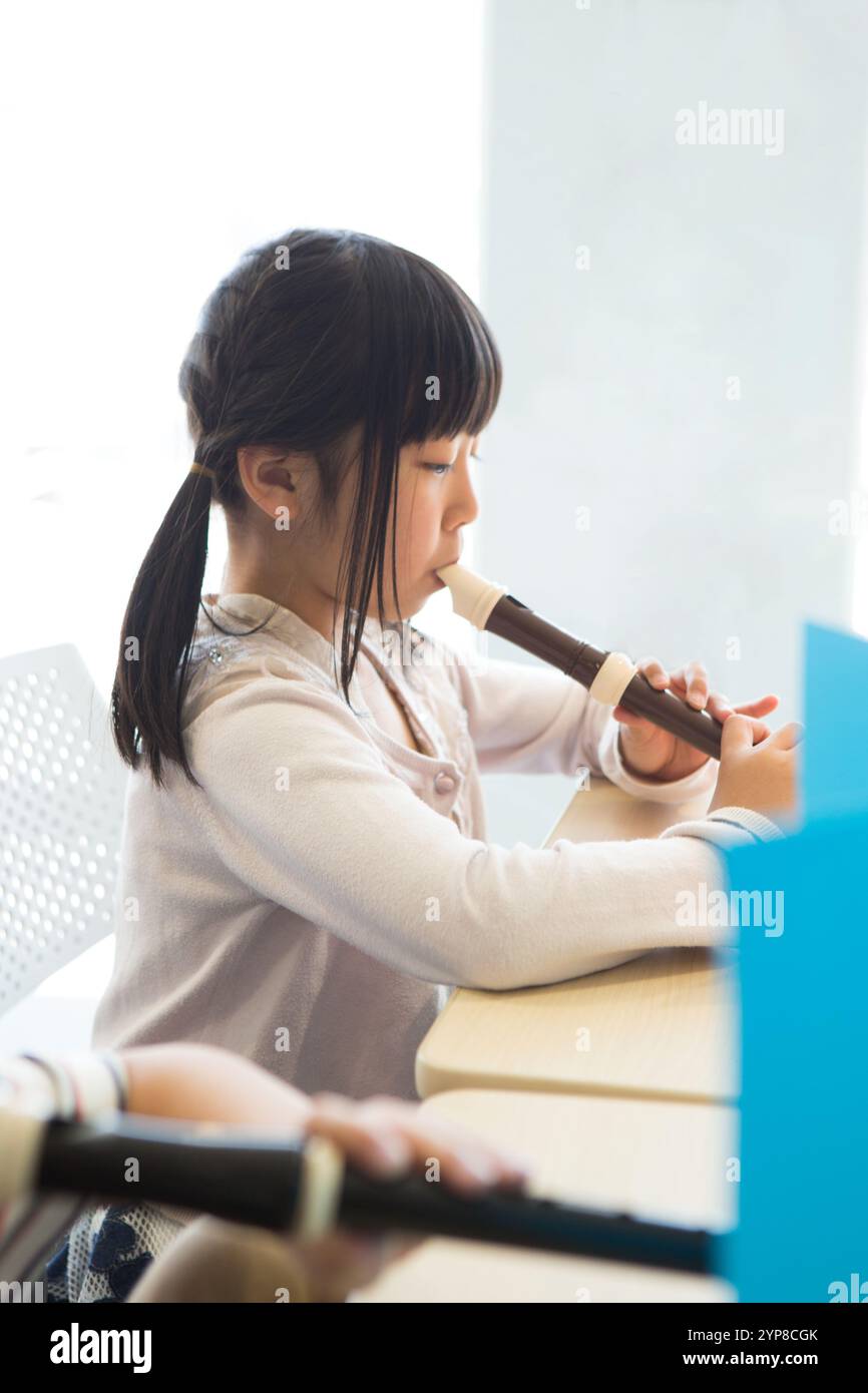 Primary school children taking music lessons Stock Photo - Alamy