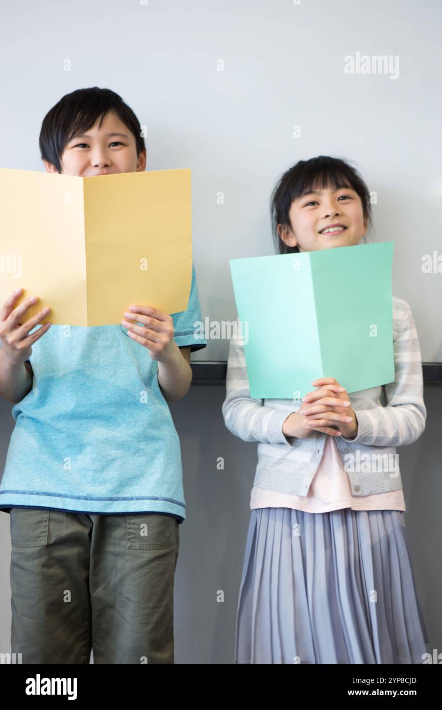 Primary school children taking music lessons Stock Photo - Alamy
