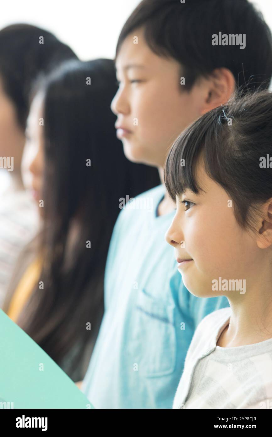 Primary school children taking music lessons Stock Photo - Alamy