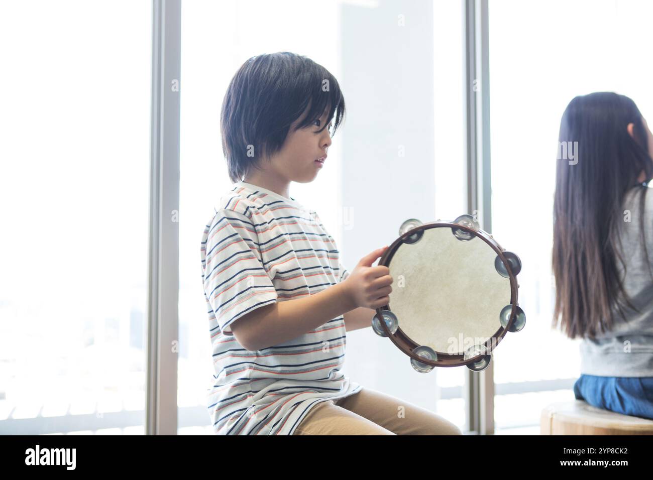 Primary school children taking music lessons Stock Photo - Alamy