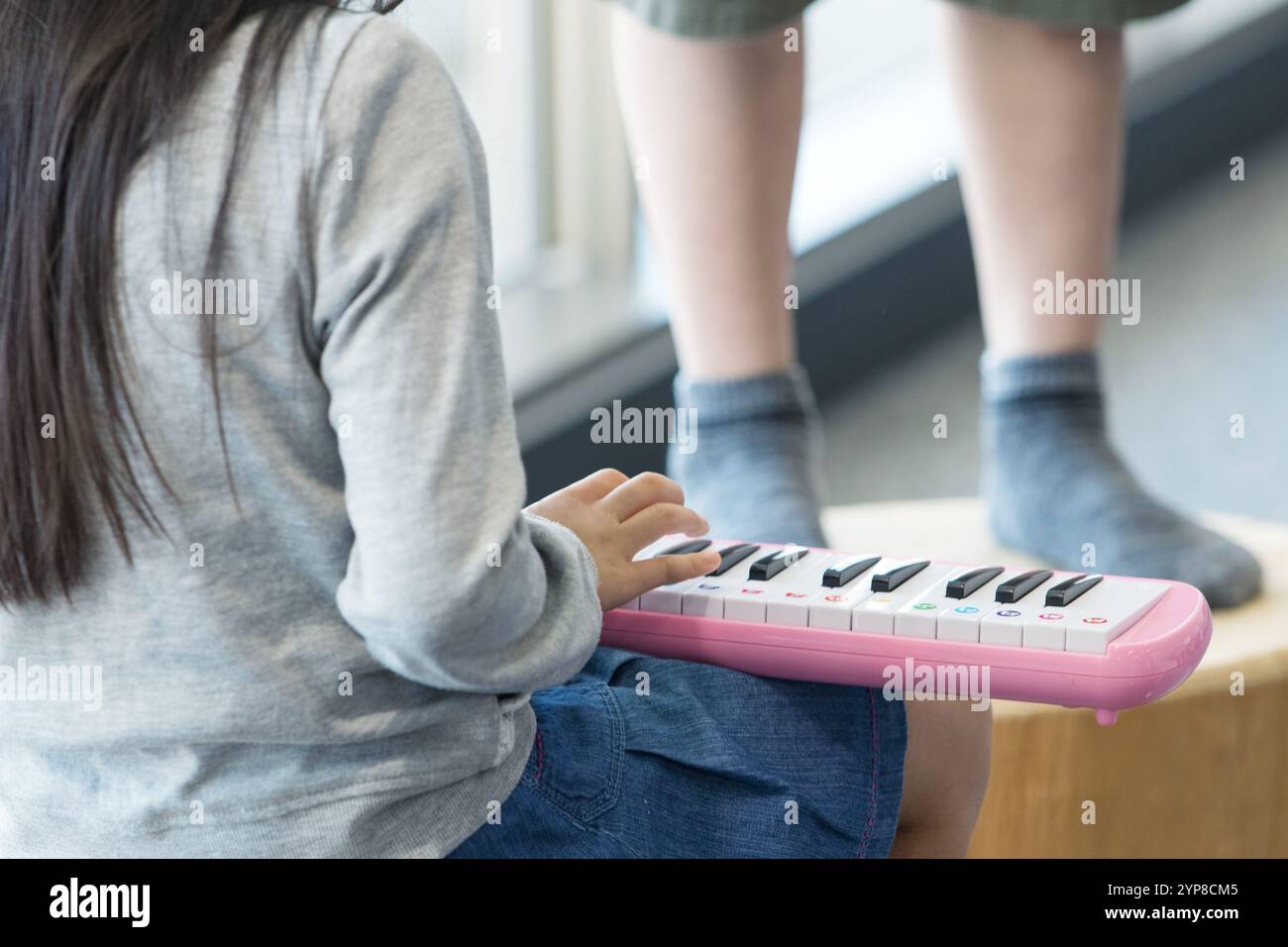 Primary school children taking music lessons Stock Photo - Alamy