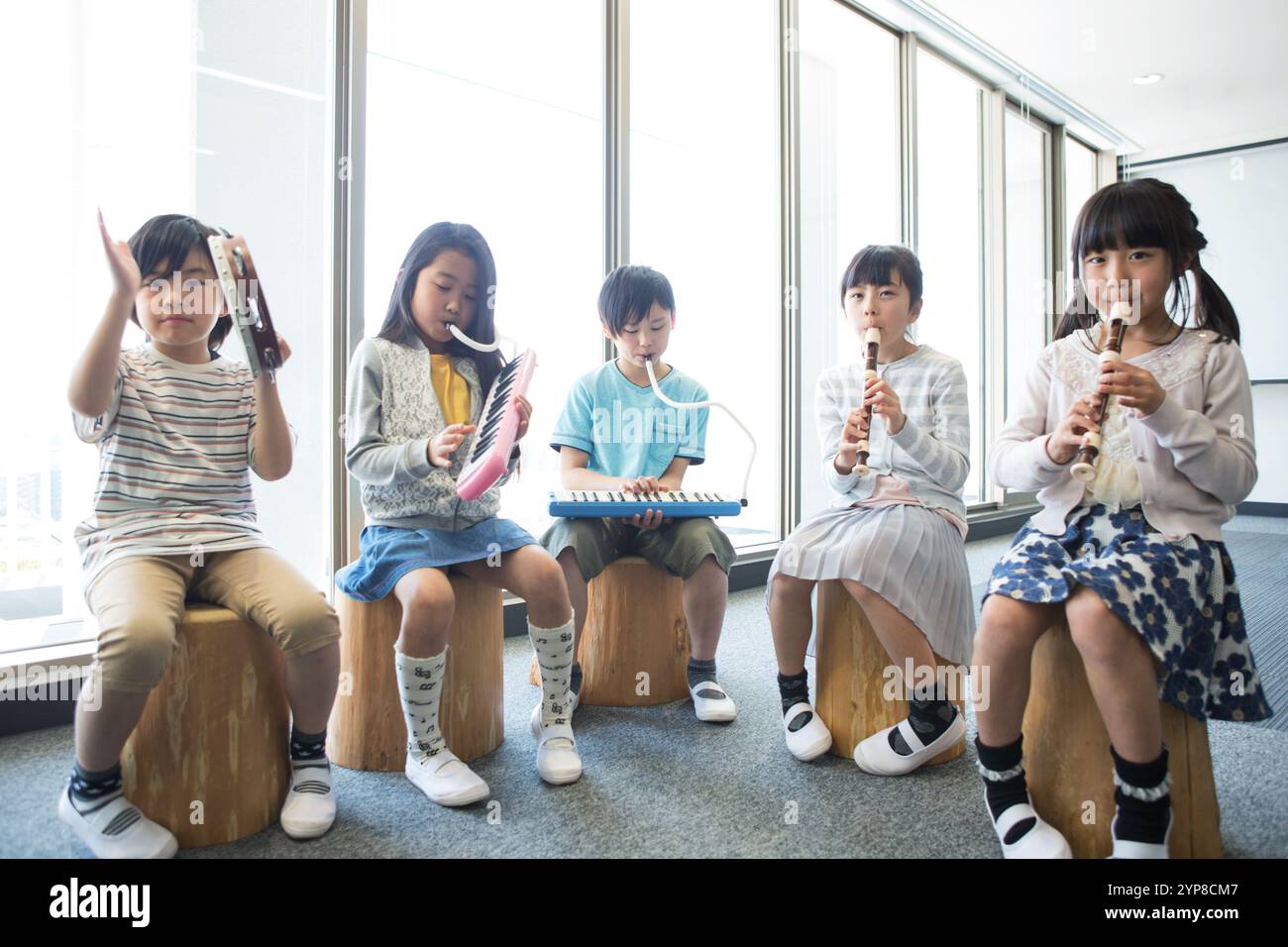 Primary school children taking music lessons Stock Photo - Alamy