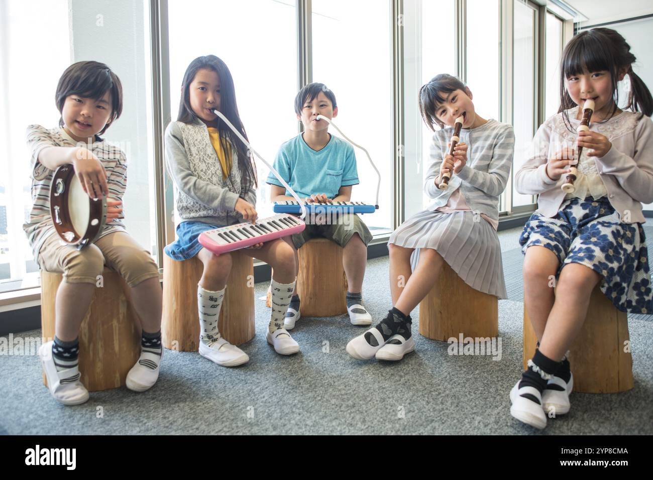Primary school children taking music lessons Stock Photo - Alamy